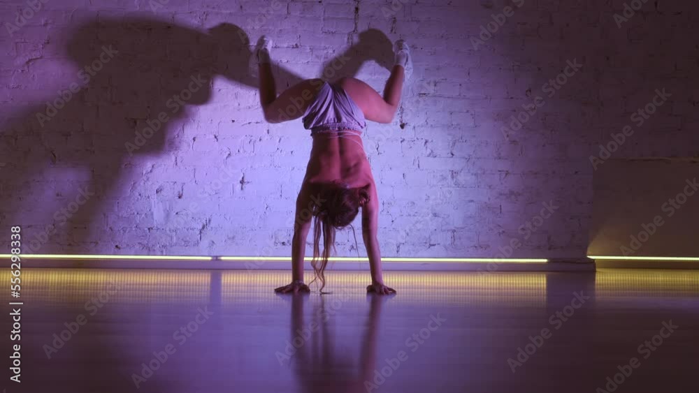 sexy woman in short shorts and a bra twerking while sitting on the ...