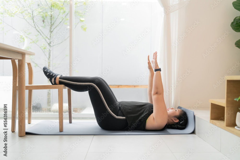 fat female person workout using chairs in living room hip raise ...