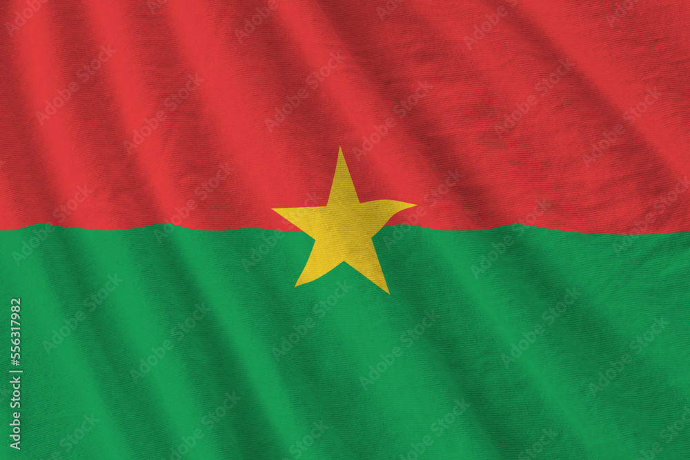 Burkina Faso flag with big folds waving close up under the studio light ...