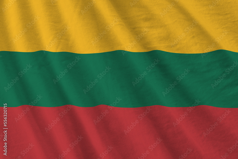 Lithuania flag with big folds waving close up under the studio light ...