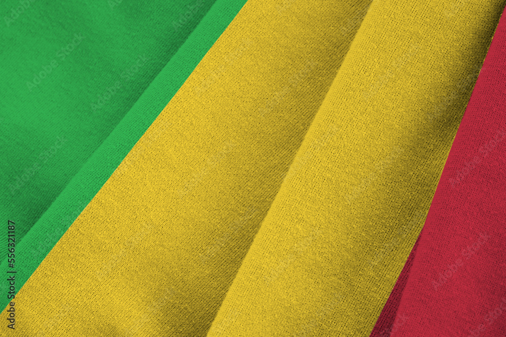 Mali flag with big folds waving close up under the studio light indoors ...