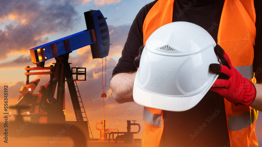 Hands of oilman with helmet. Man works in oil field. Circumcised guy ...