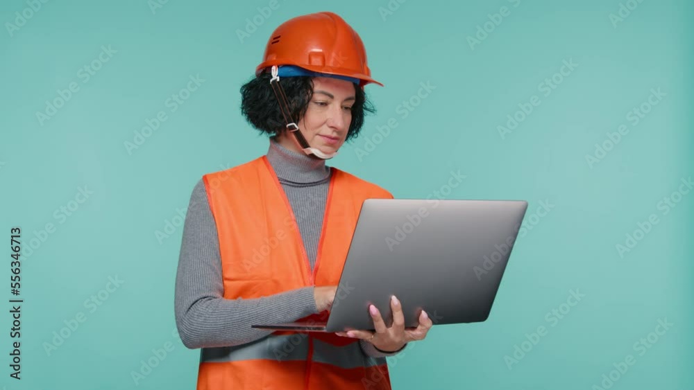 Female civil engineer, young female building architect use laptop on ...