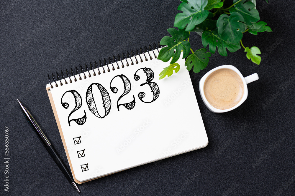 New year resolutions 2023 on desk. 2023 resolutions list with notebook ...