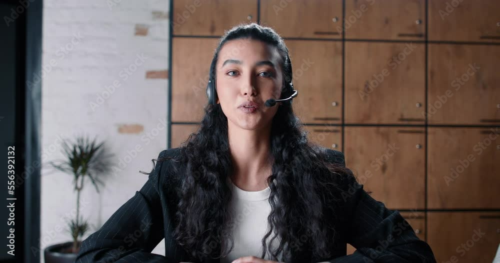 Smiling young woman gives online interview to get the good job of her ...