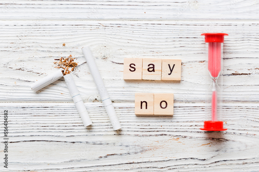 Cigarette And Wooden Blocks, Broken cigarette on table background with ...