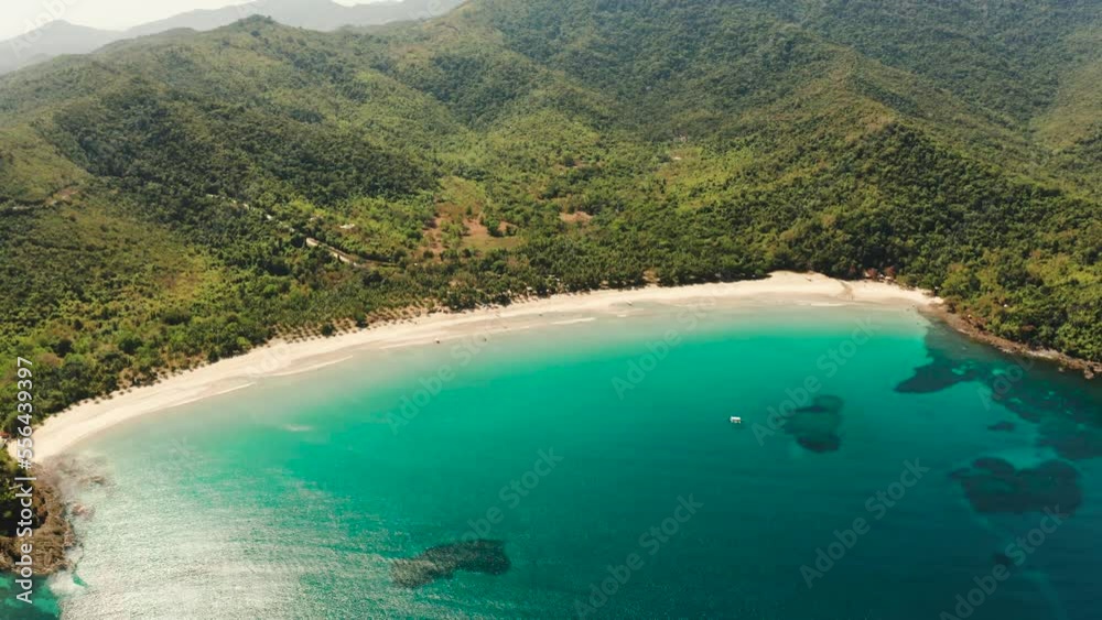 Aerial view beautiful tropical beach Nagtabon in the cove with blue ...