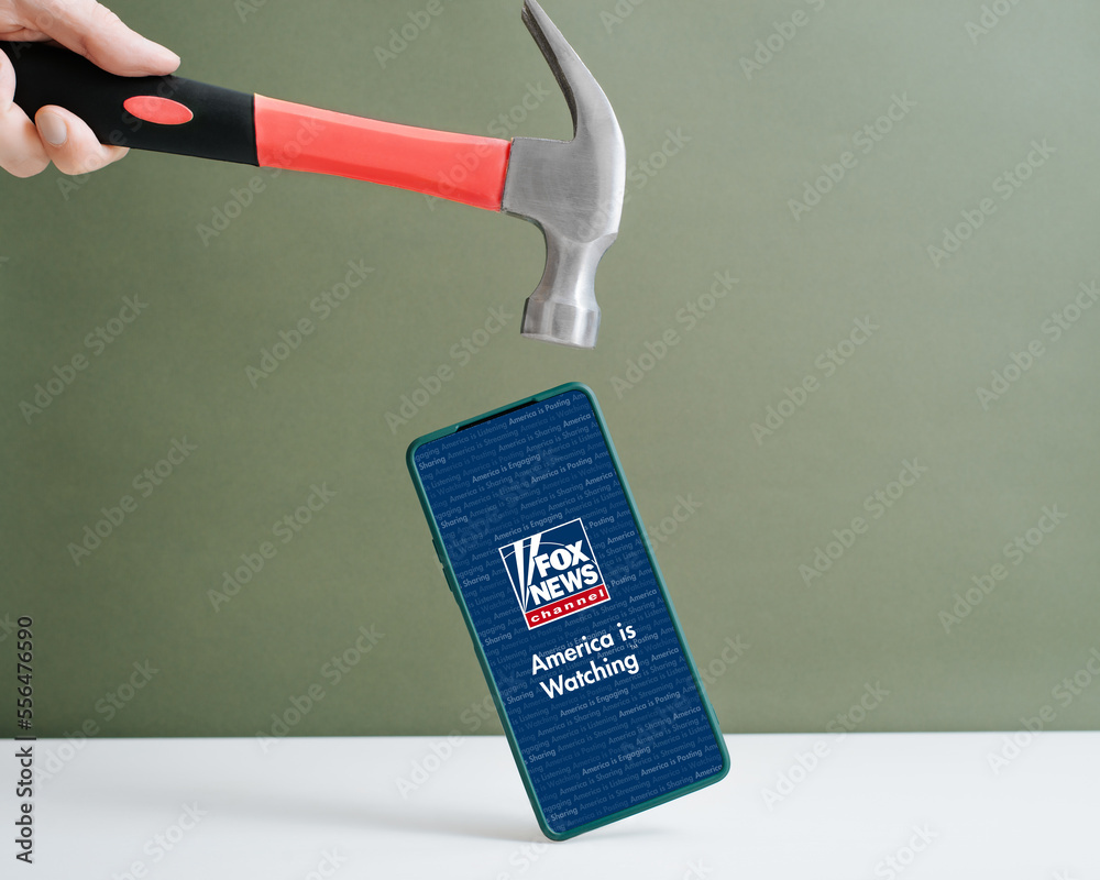 Hammer smashing phone with Fox News mobile app American news channel on ...