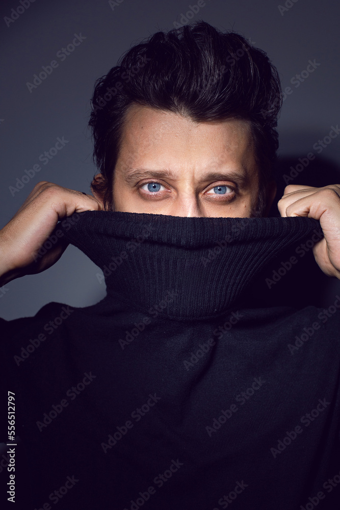 Fashion Portrait of a 35 year old man standing over a light gray ...