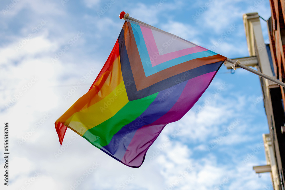 Celebration of pride month in Amsterdam, New rainbow flag hanging ...
