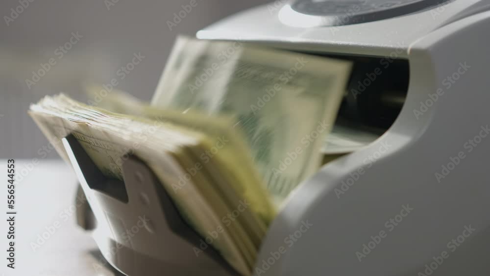 Close-up cash banknotes calculating in counting machine indoors. Money ...