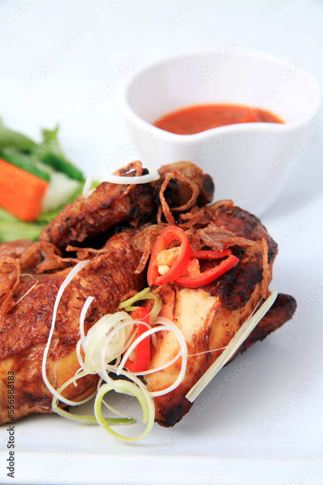 traditional Indonesia or south east asia chicken fried with chili sauce ...