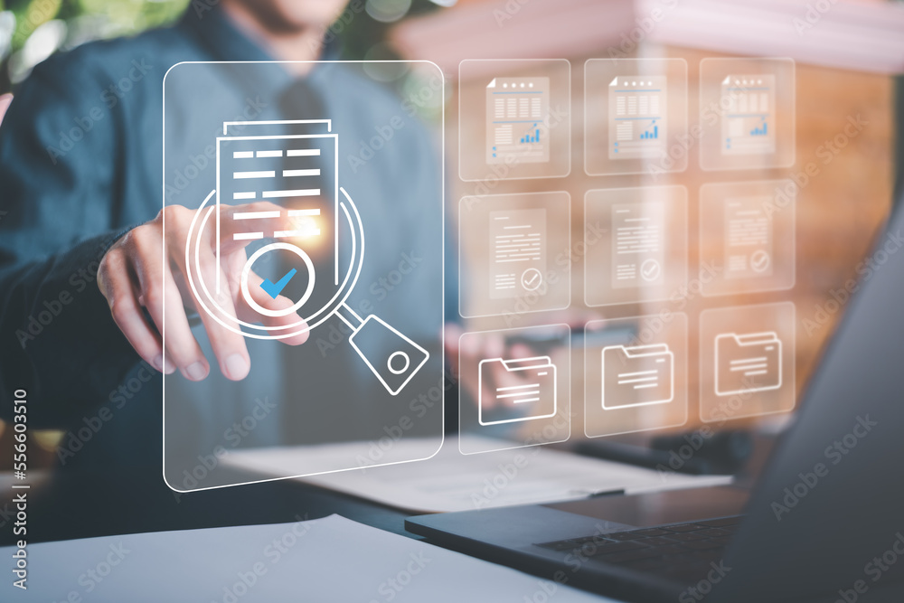 Businessman Audit documents, quality assessment management With a ...