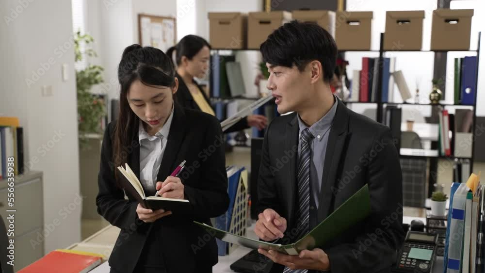 portrait of friendly asian male mentor wearing suit teaching young ...