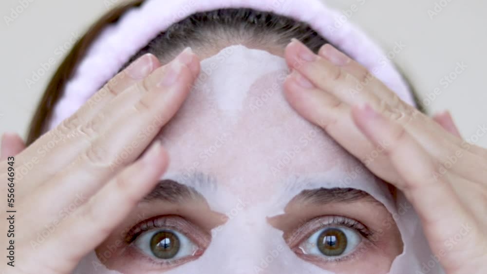 close up woman girl eye applying white cream under eyes bag or facial ...