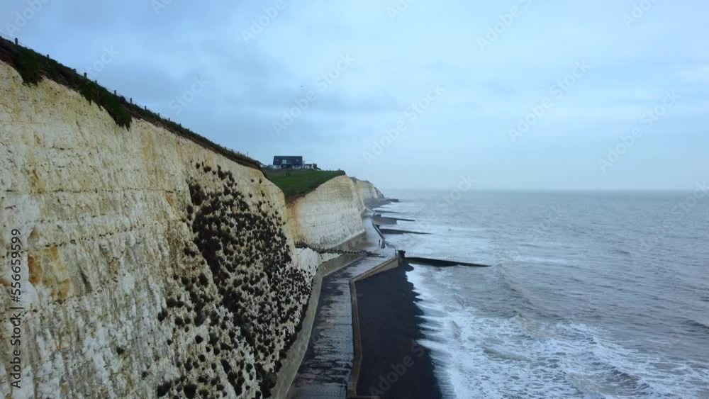 Chalk cliffs on coast with sea water erosion and climate change damage ...