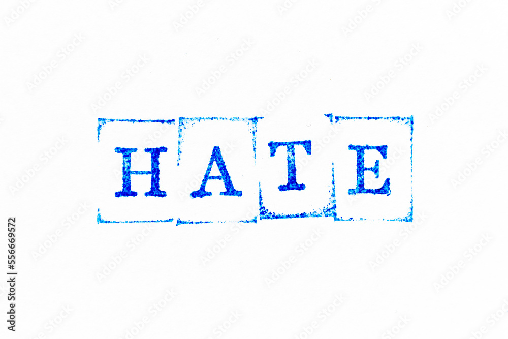 Blue color ink rubber stamp in word hate on white paper background ...