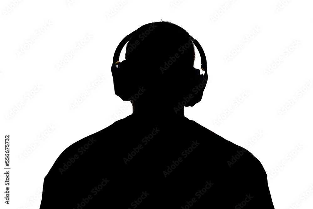 Silhouette of a man listening to music with headphones on a transparent ...
