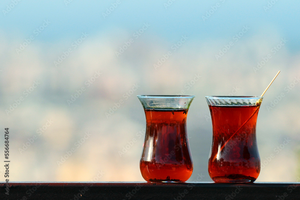 Two bardaks, traditional glasses with hot turkish tea in an outdoor ...