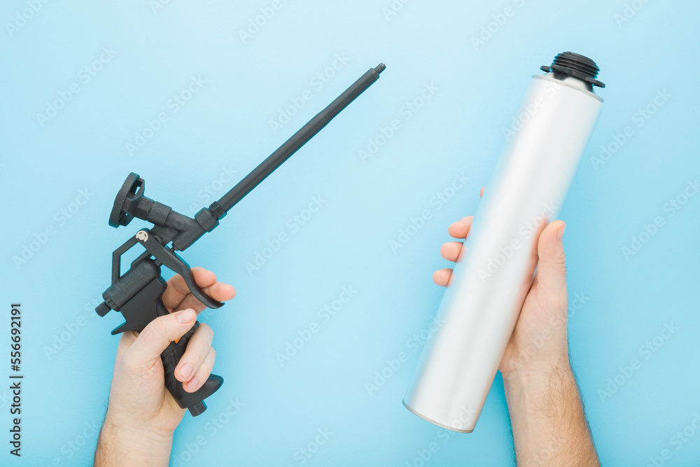 Young adult man hands holding and showing black professional foam spray ...