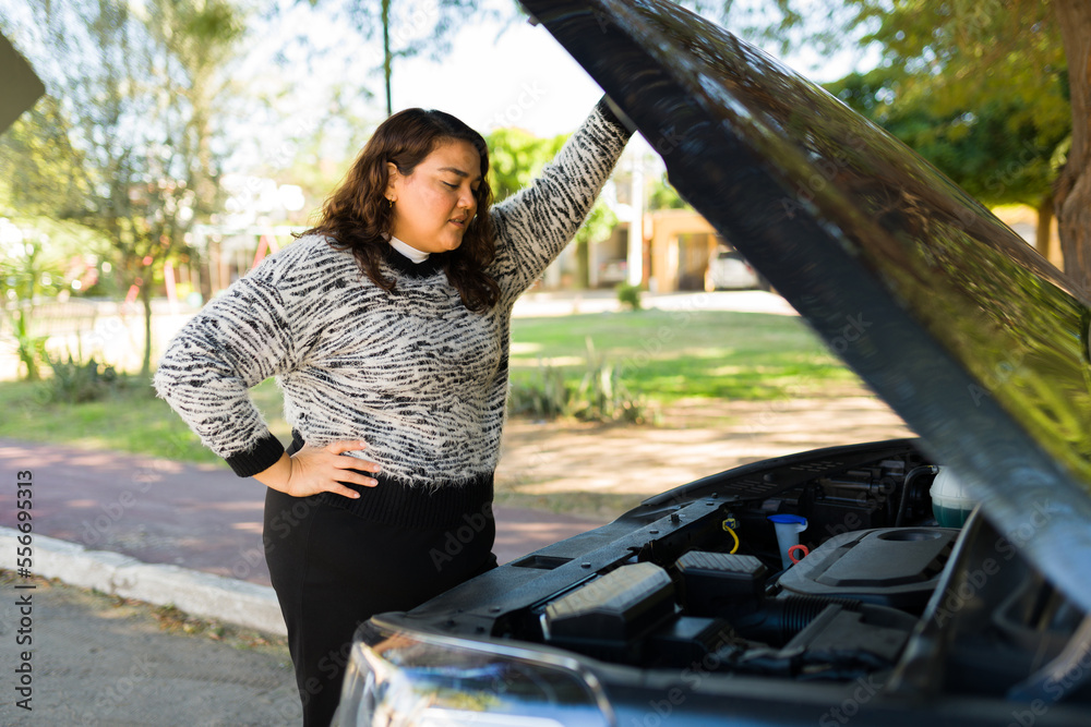 Worried overweight woman with car problems Stock Photo | Adobe Stock