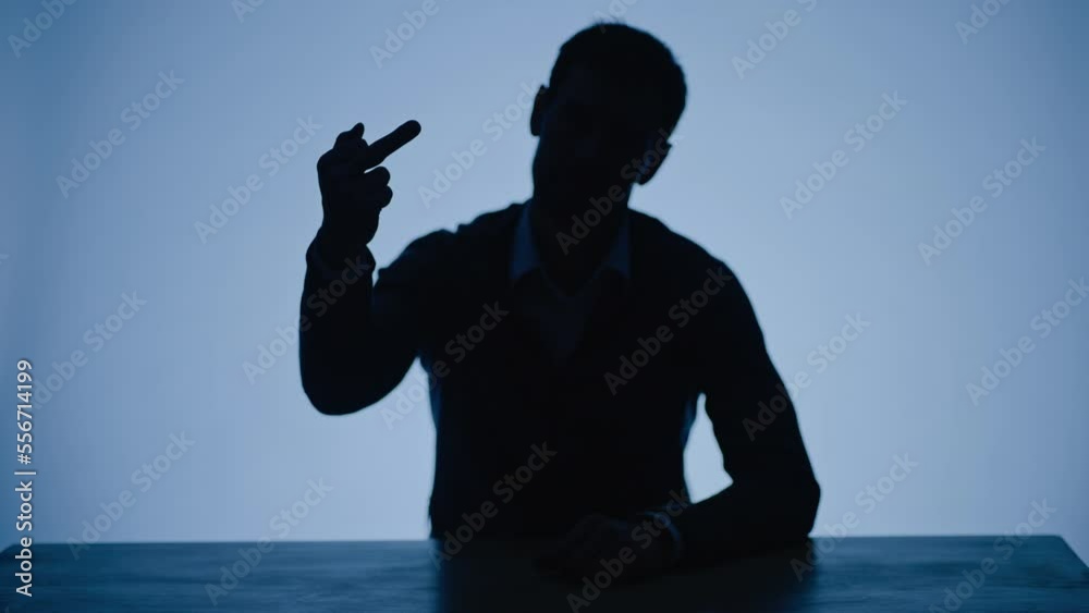 Silhouette of a rude angry man demonstrating middle finger. Humiliating ...
