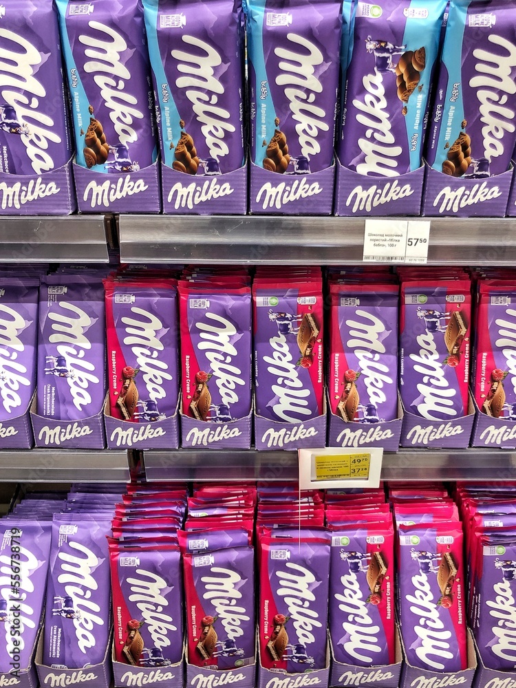26.12.2022, Ukraine, Kharkiv, Milka chocolate on store shelves. Many ...