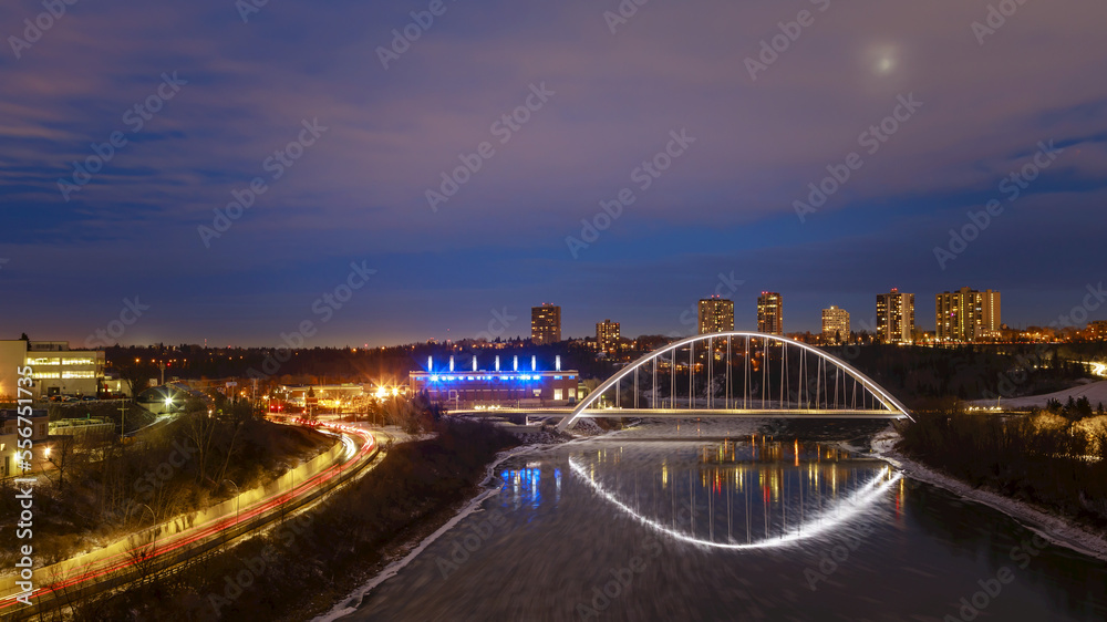 Edmonton skyline at night with reflections of the Walterdale Bridge ...