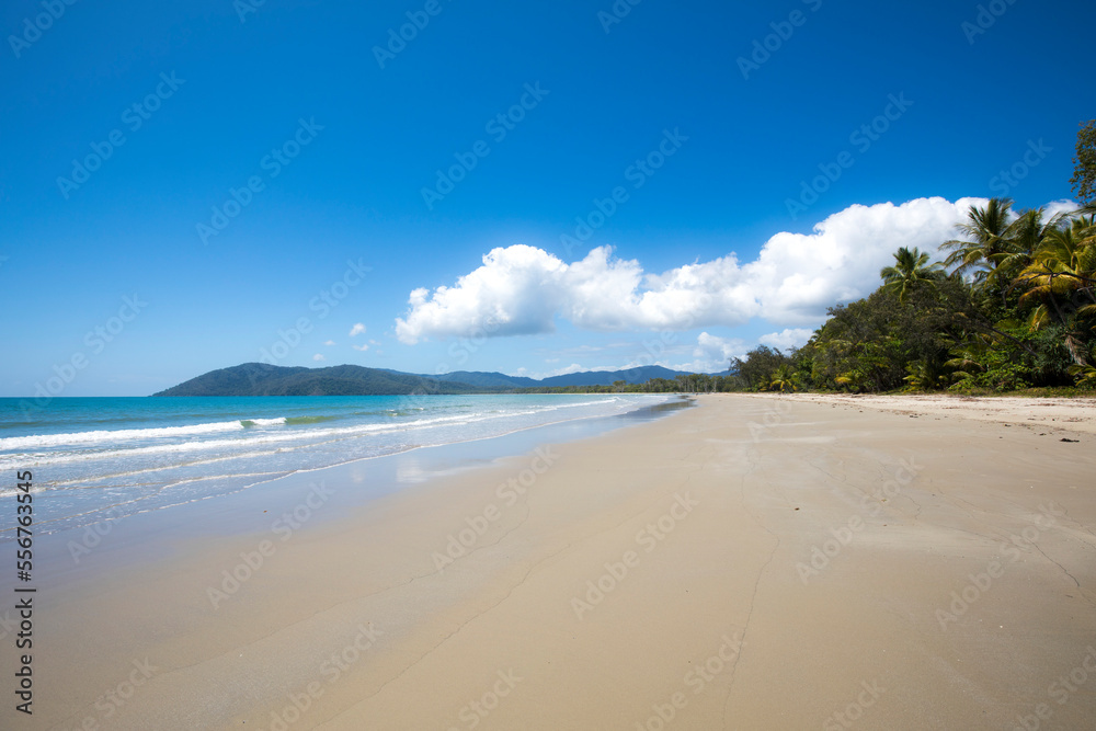 Pristine sand of Thornton Beach with the surf of the Coral Sea meets ...