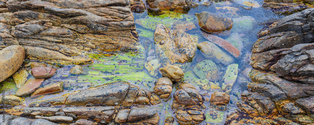 Natural beauty of a clear water stream sitting over a natural rock ...