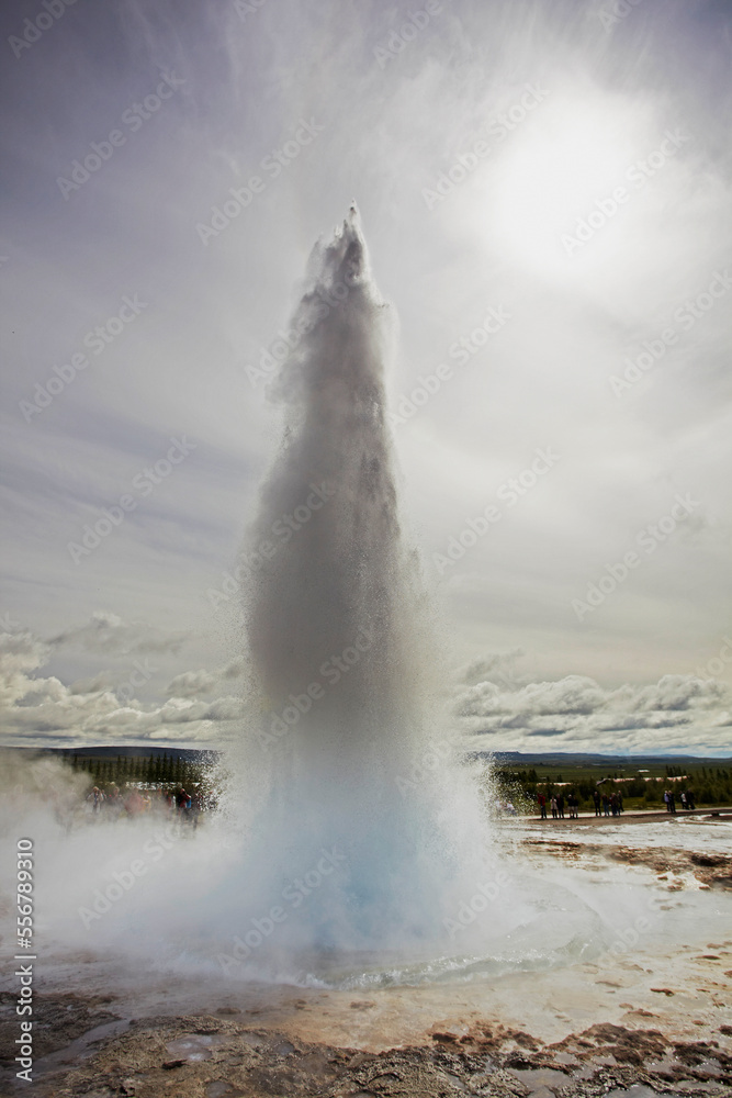 The Strokkur geysir erupts, Geysir, in the Golden Circle, Iceland.; At ...
