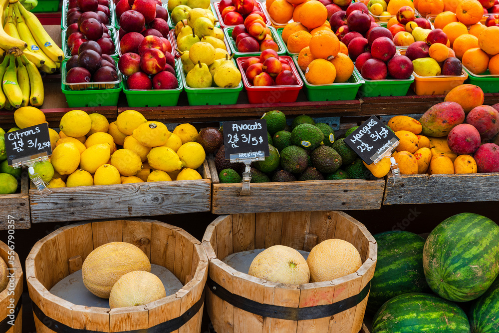 Fresh produce in a colourful display for sale at a supermarket with ...