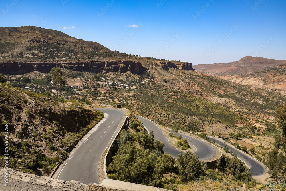 Winding paved road through the Ethiopian Highlands below a rural ...