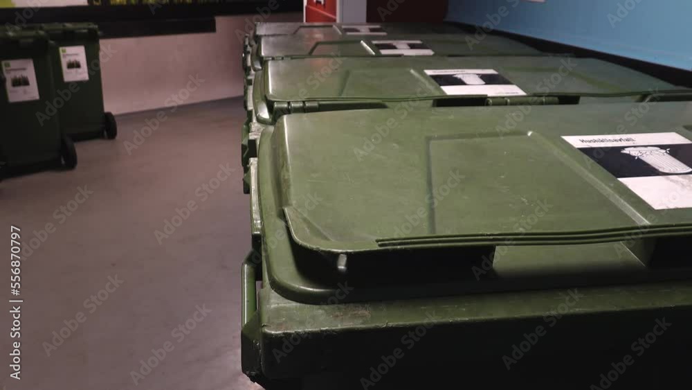 Stockholm, Sweden A resident in a housing complex places his garbage ...