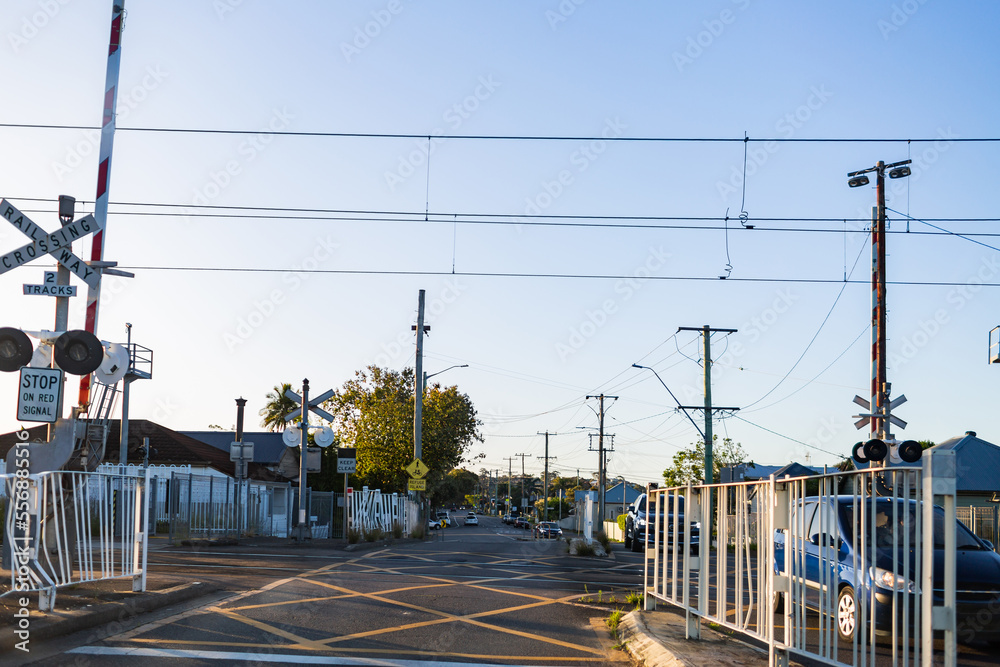 Cars crossing over railway line on main road in Newcastle Stock Photo ...
