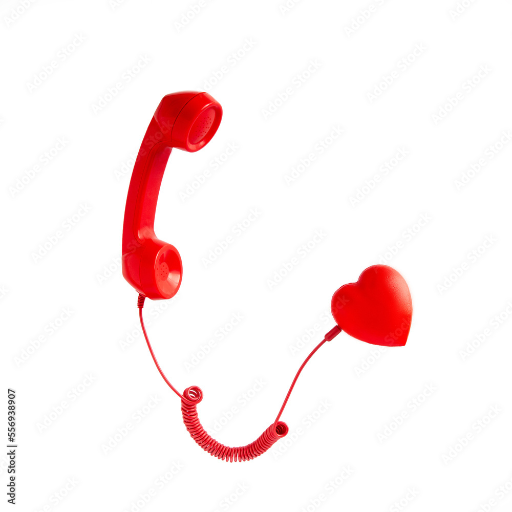 Retro red telephone handset connected to red heart on white background ...