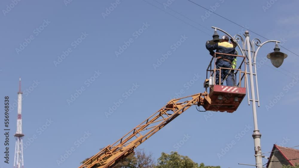 crane lifted, diode lights, repair works. Equipment installs, Street ...