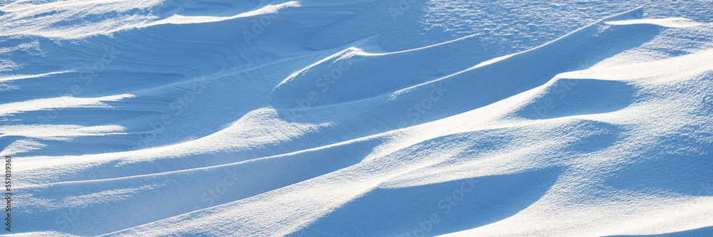 Snow texture. Wind sculpted patterns on snow surface. Wind in the ...