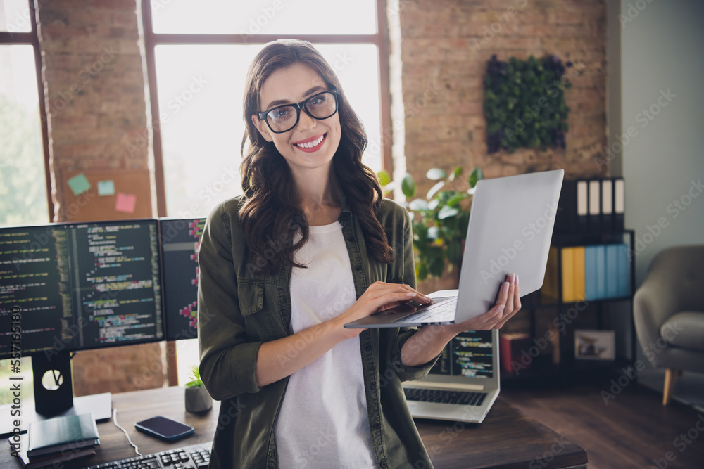 Photo of positive charming lady hold modern netbook start working ...