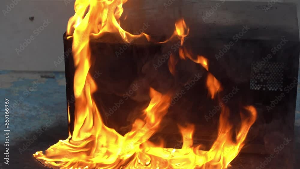 microwave oven on fire. the concept of fire in the kitchen and ...