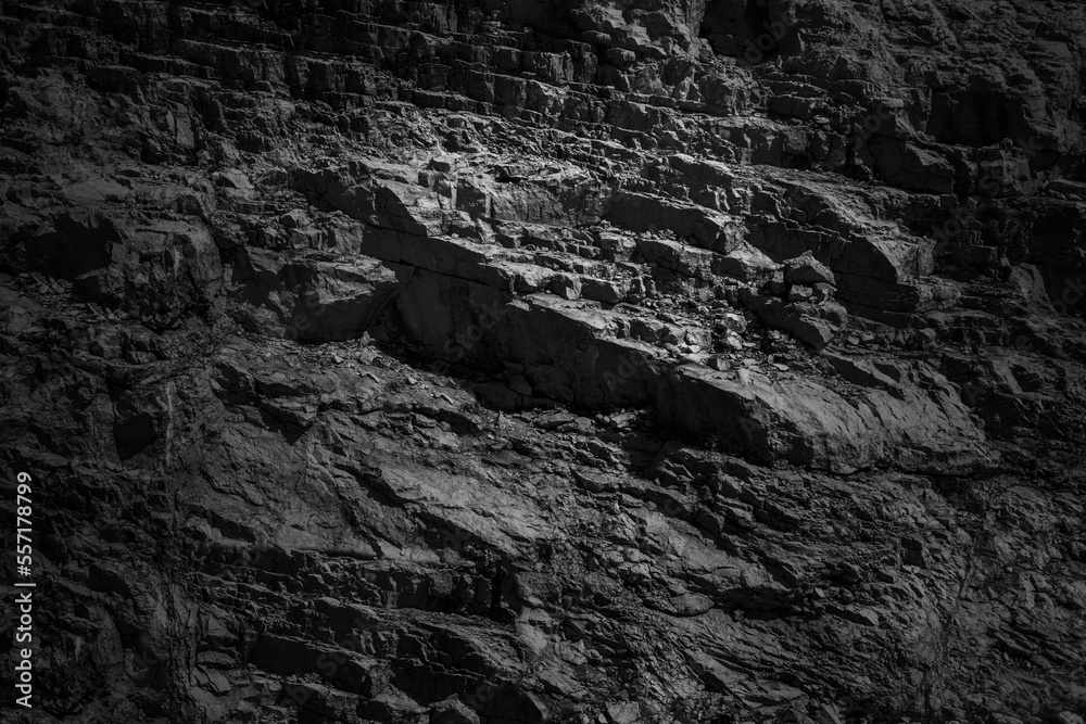 Grungy cragged bumpy pitted cavity stone facade, split layer gap.Ruined ...