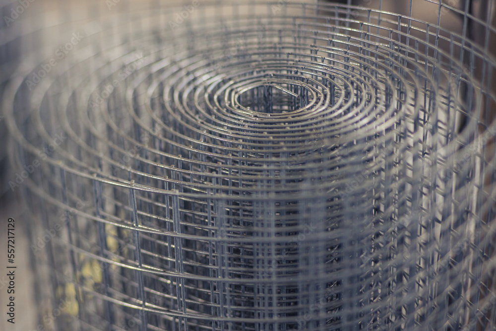 Metal mesh close-up, metal background slightly blurred. Metal grid for ...
