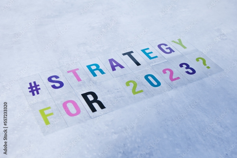 Colorful letters on concrete background saying 'Strategy for 2023 ...