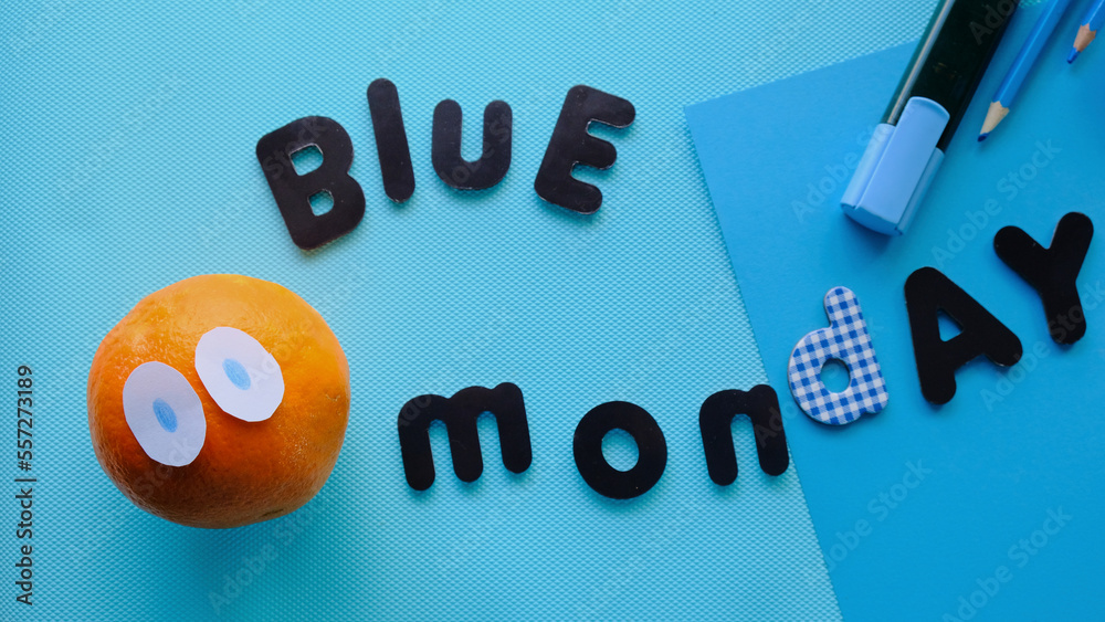 Letras de BLUE MONDAY en un fondo azul con una naranja con ojos y ...
