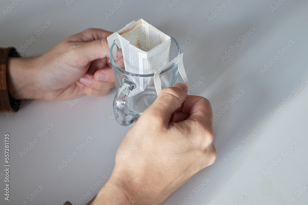 brewing process,a bag filled with boiling water for drip coffee in a ...