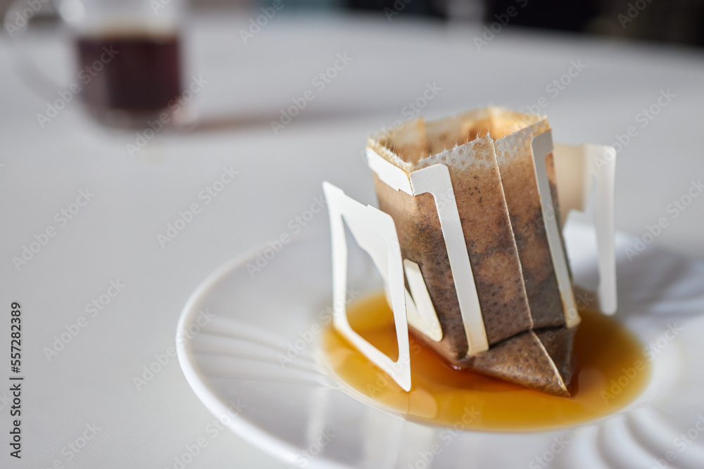 brewing process,a bag filled with boiling water for drip coffee in a ...