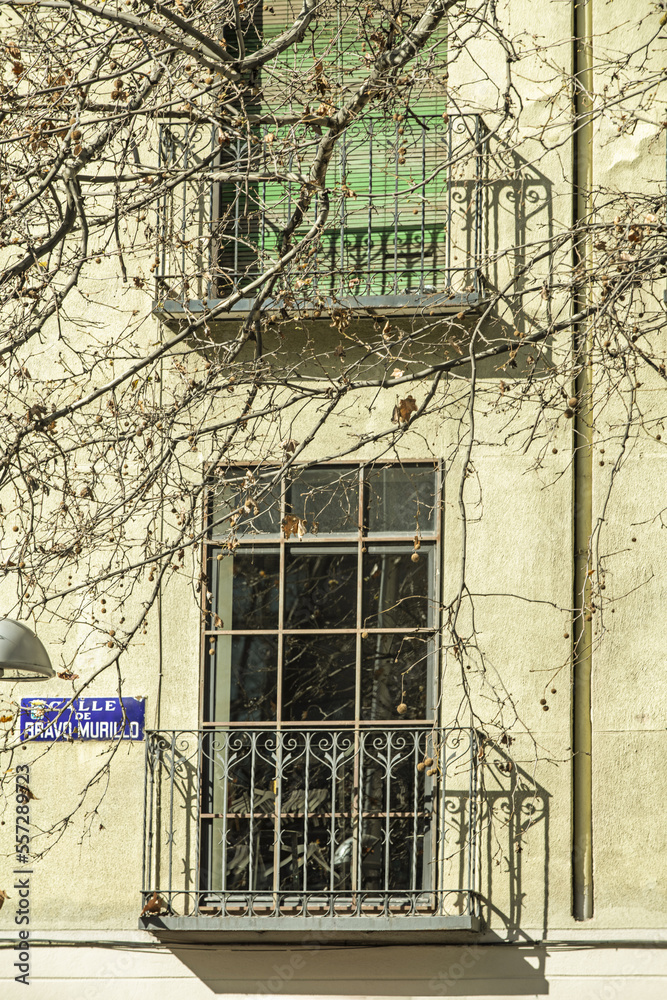 Facade of a building with balconies with black metal wrought iron ...