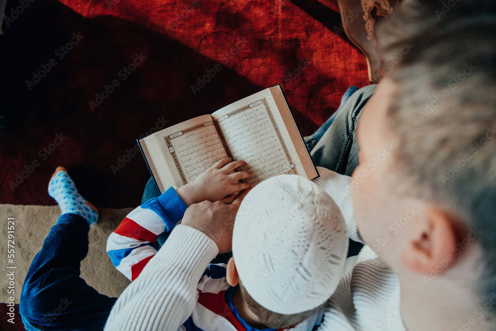 Foto de Muslim prayer father and son in mosque praying and reading ...