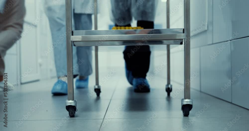 Doctors feet walking down hospital corridor with gurney close up. Stock ...