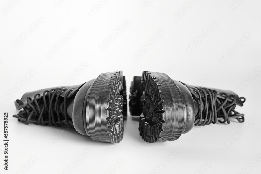 Black women combat boots on high heel platform with lug soles lying on ...